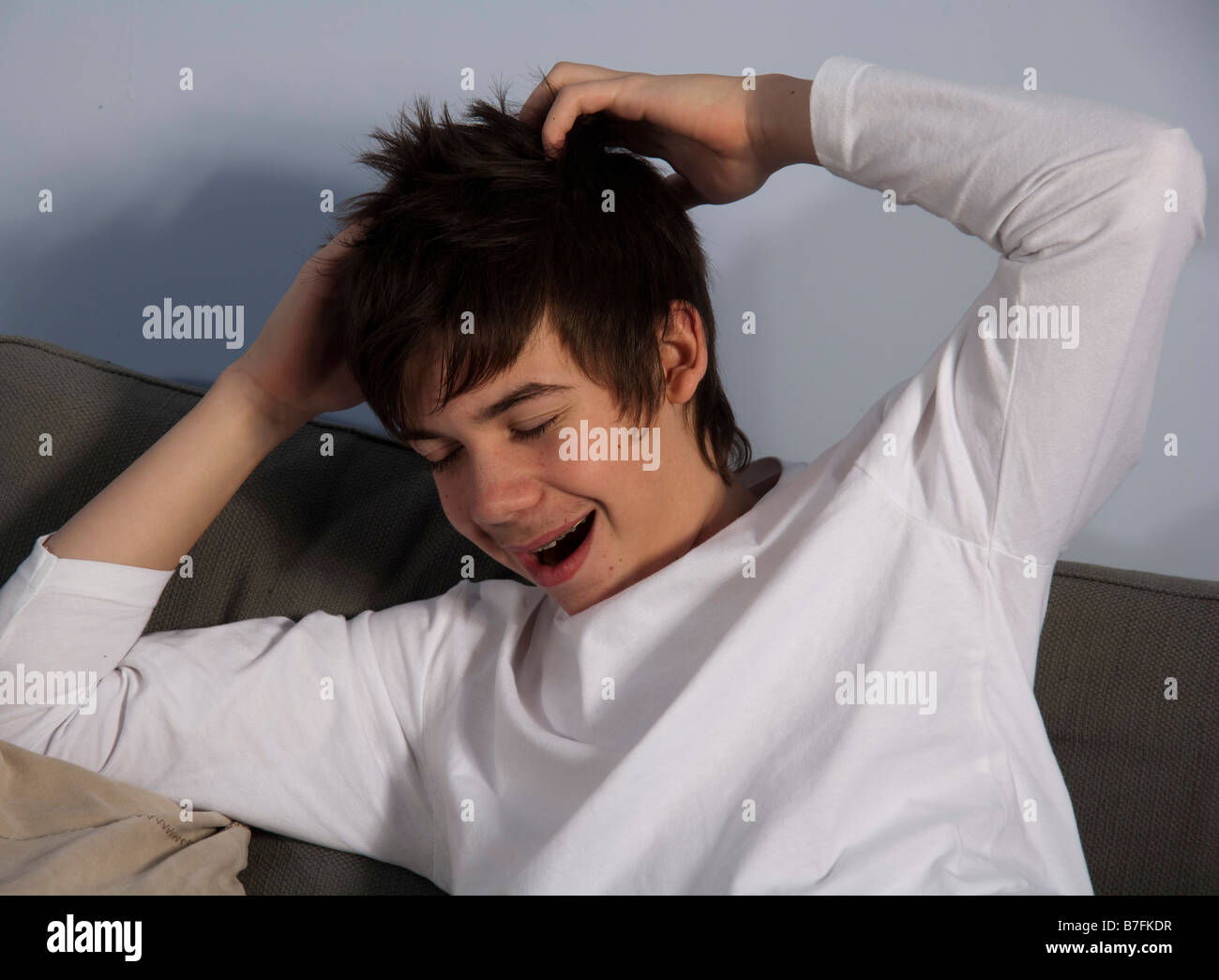 teenage boy sleeping on couch Stock Photo - Alamy