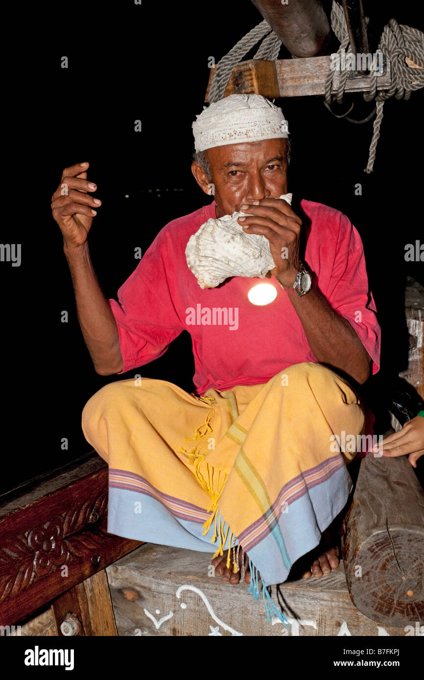 Conch shell blowing hi-res stock photography and images - Alamy