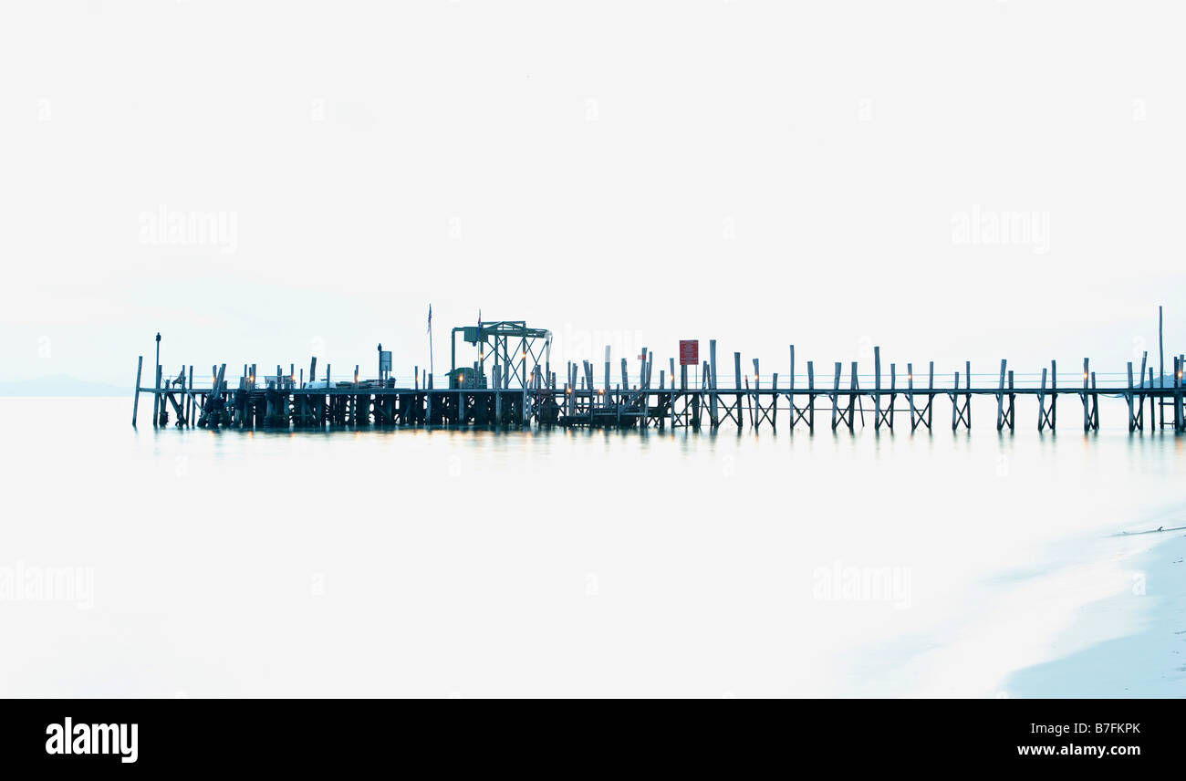Old timber jetty with white background Stock Photo - Alamy