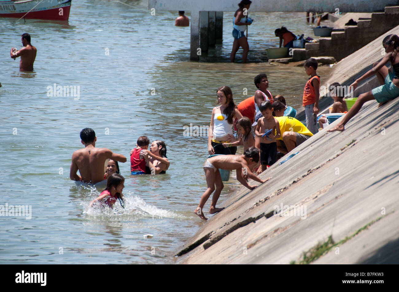 Families come down to the river at lunchtime to swim wash and relax ...