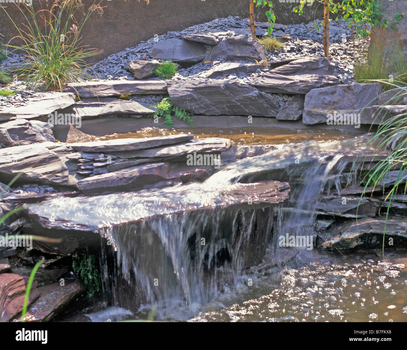 WATERFALL MADE FROM NATURAL STONE Stock Photo - Alamy