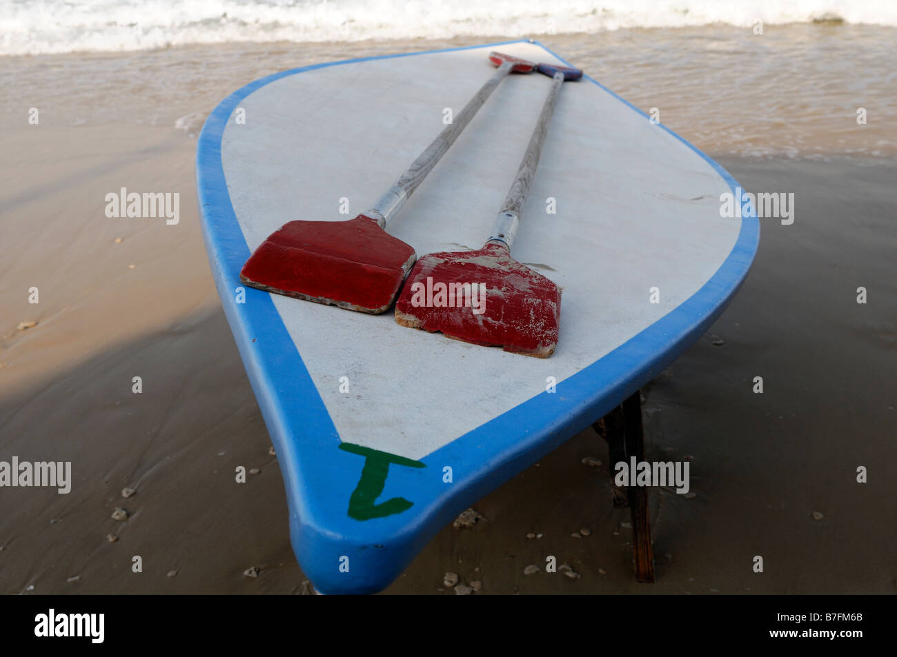 lifesaver rescue board paddle at the ready on the beach swim safety ...