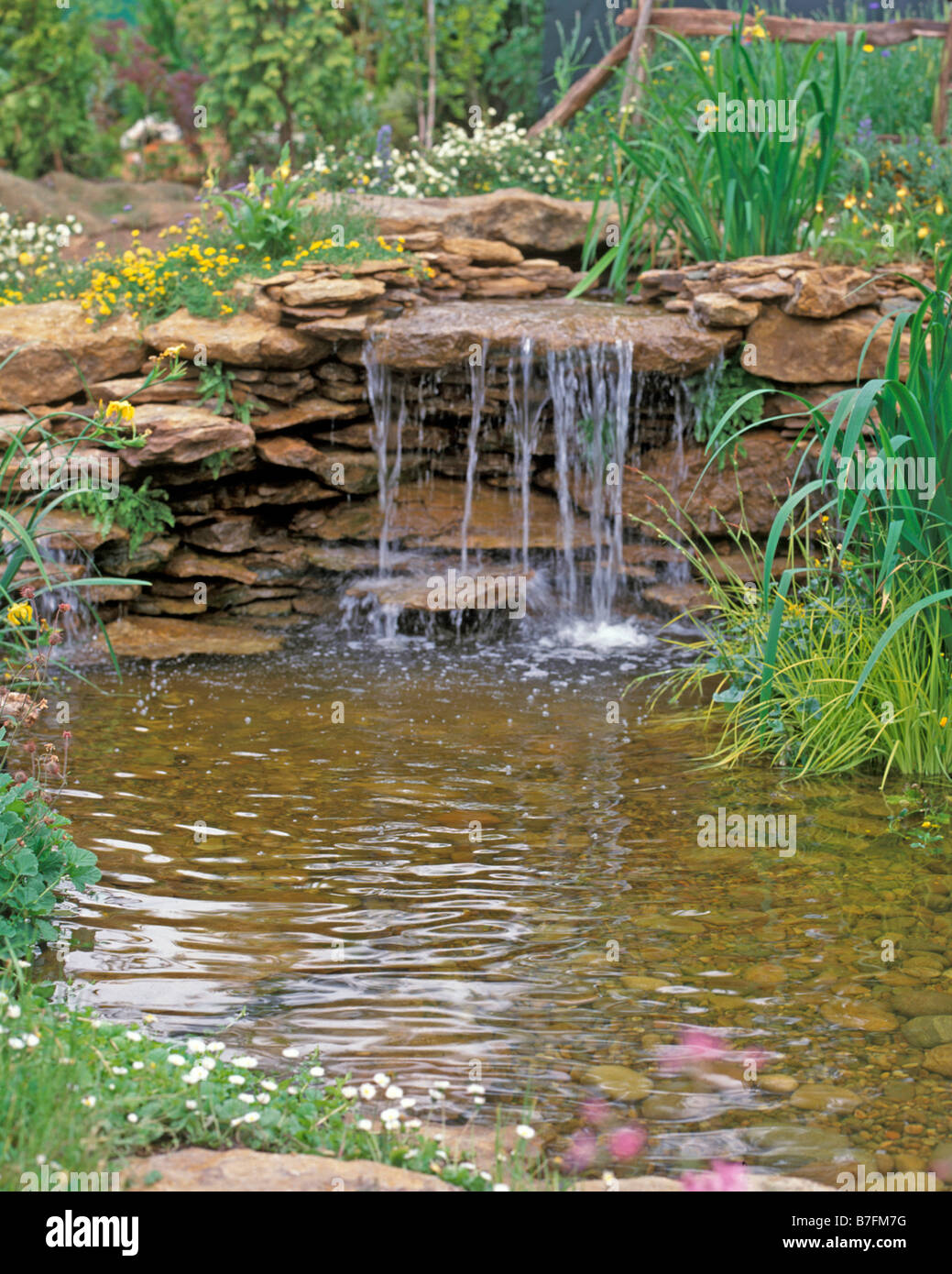 NATURAL STONE WATERFALL AND POOL Stock Photo - Alamy
