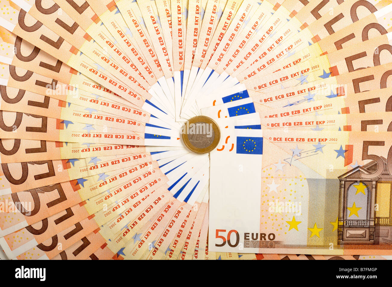 Stock photo of a fan of 50 Euro notes In the centre is a single 1pound ...