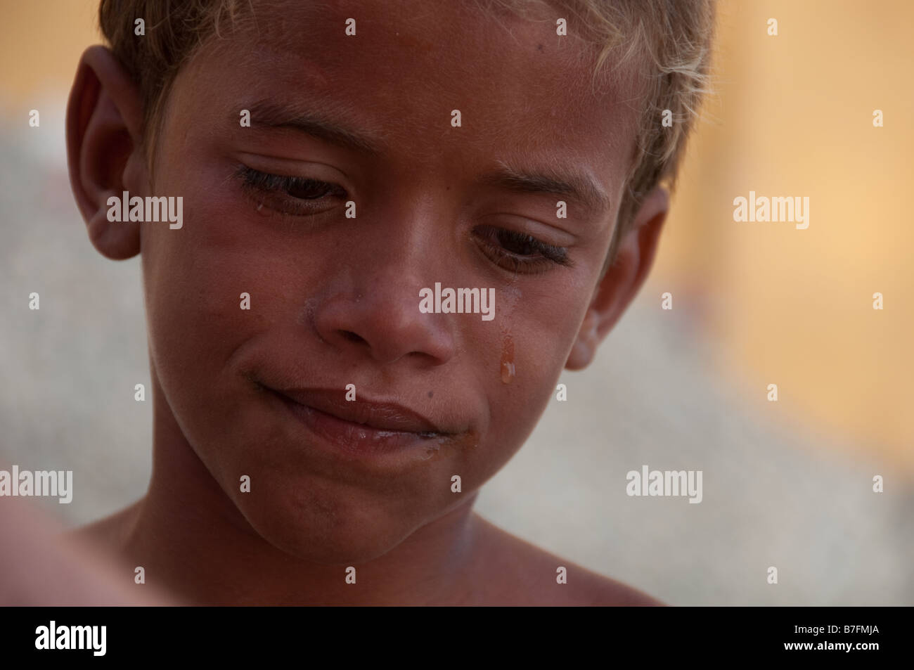 A boy cries because he does not get a coin from a tourist Piacabucu is ...