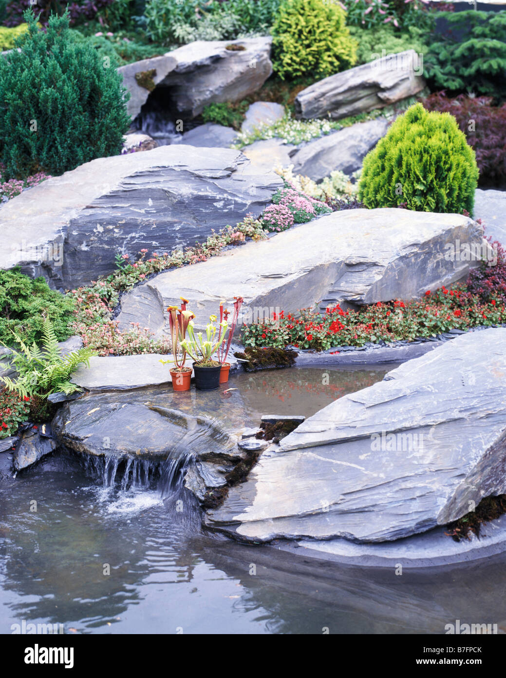 WATERFALL BASED ON LARGE GRANITE BLOCKS AND CONIFER PLANTING Stock ...