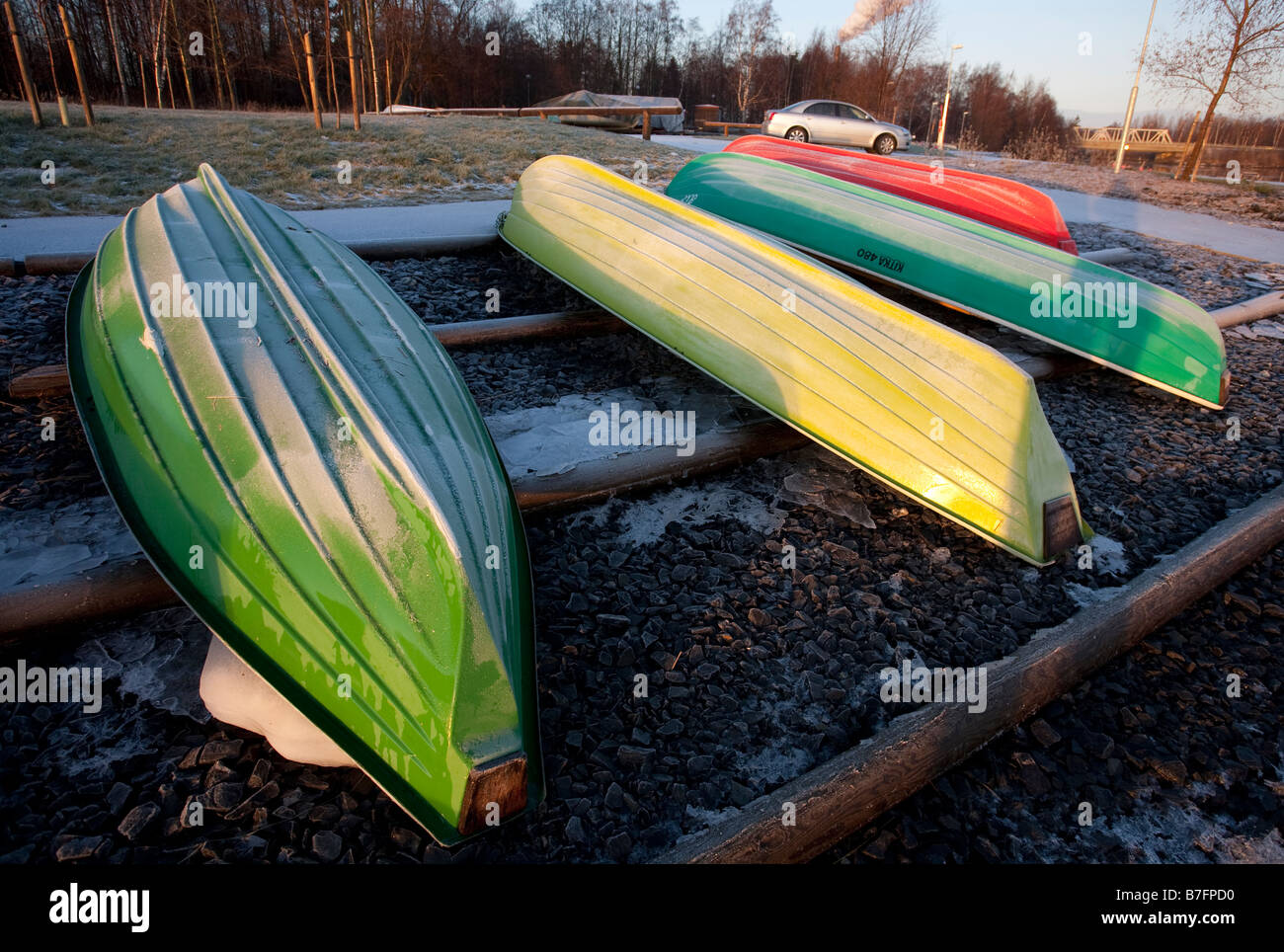 Four fiberglass rowboats / skiffs / dinghy / dinghies , upturned for ...