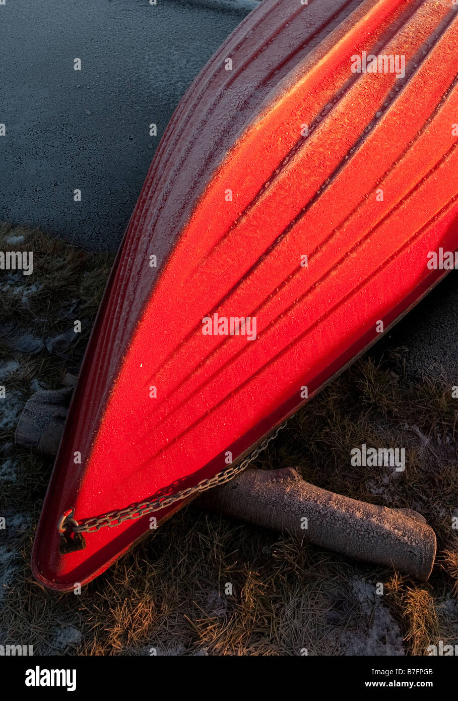 Bow of a red upturned fiberglass rowboat / skiff / dinghy Stock Photo ...