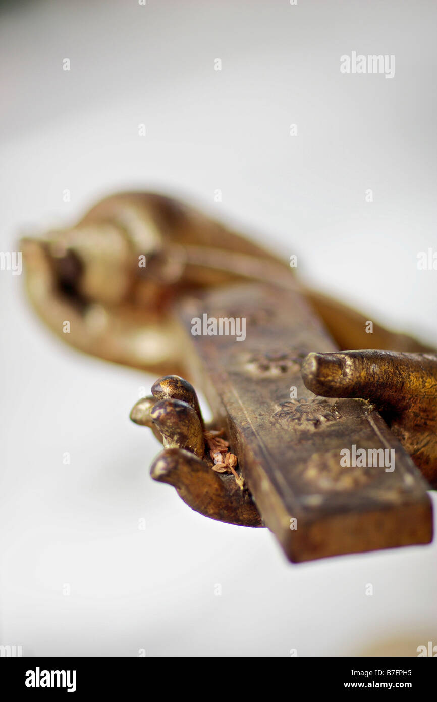 Indian golden statue hand detail Stock Photo - Alamy