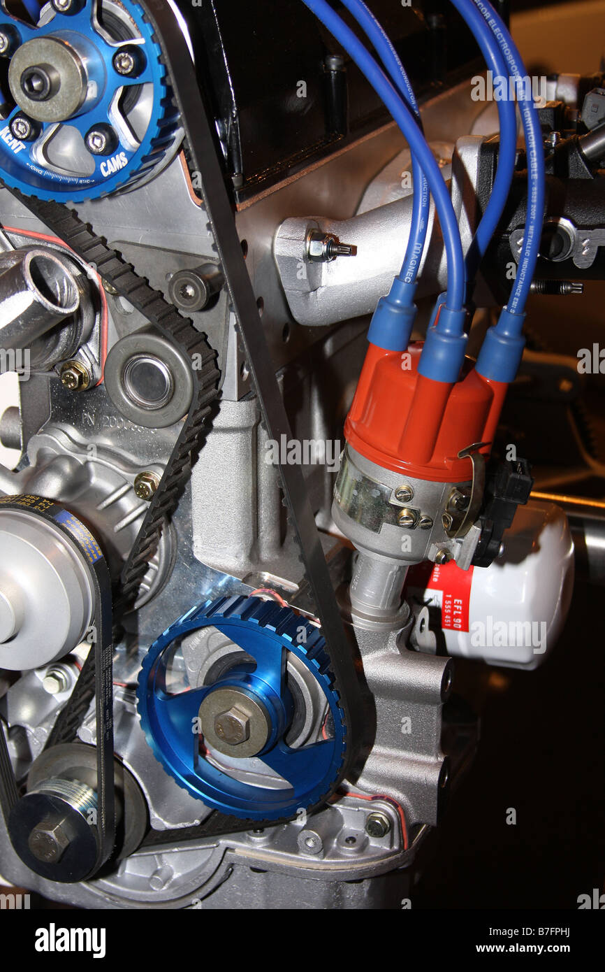 Power disributor and cables on engine with cogs and timing belt in view ...