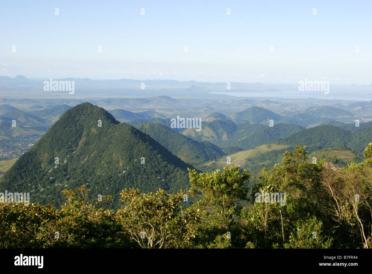 View of hills of Atlantic Rainforest and Rio Bay Tres Picos State Park ...