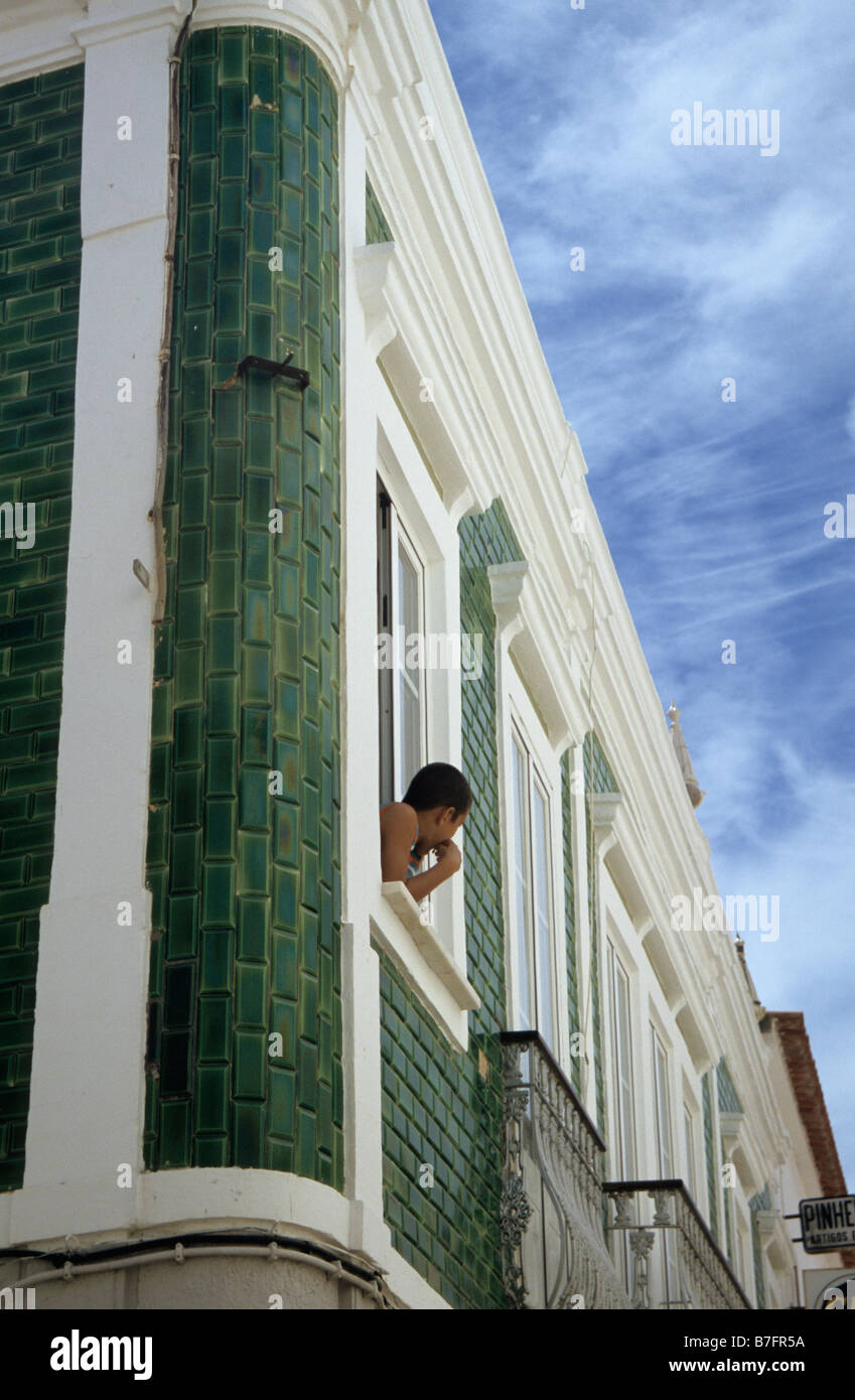 Boy in a window, Lagos, Portugal Stock Photo - Alamy