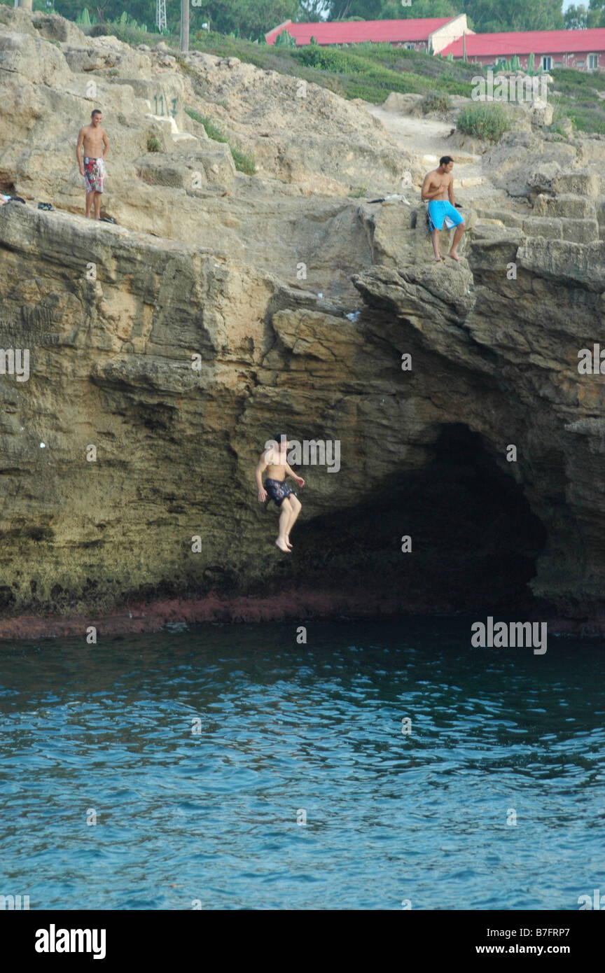 Israel Rosh Hanikra people diving into the water from the cliff Stock ...