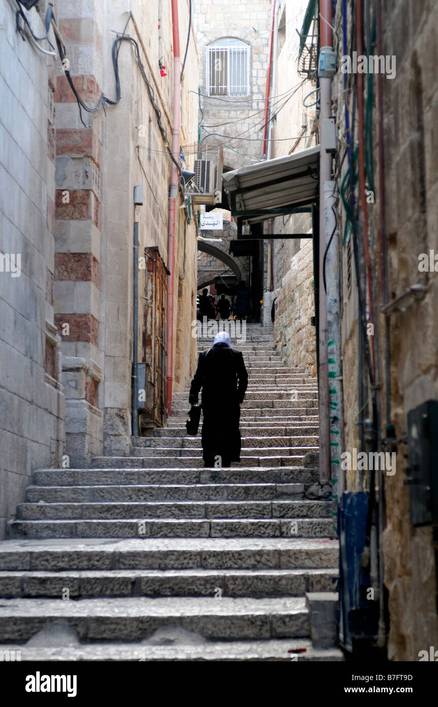 woman dressed in black walking up steps side street steps way of the ...