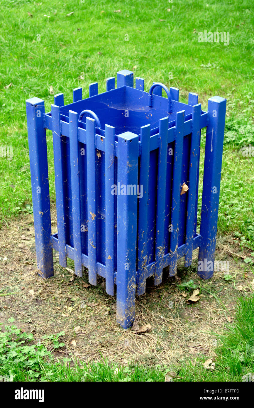 Blue litter or trash bin in park close up Stock Photo - Alamy