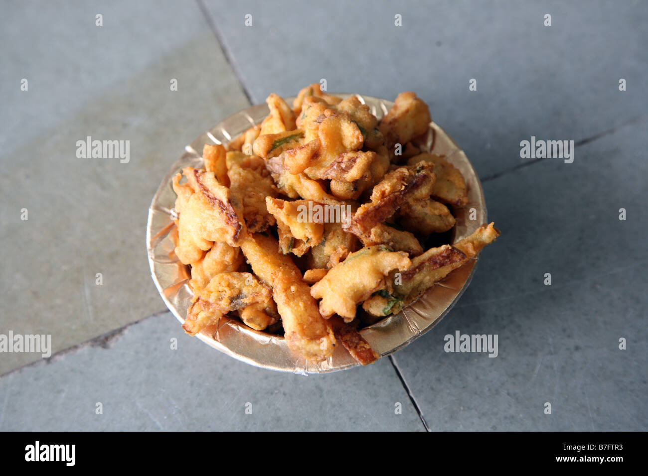 Deep fried vegetable pakora snacks sold on the platform Agra station ...