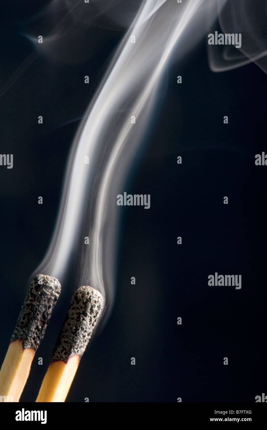 object on black match with smoke Stock Photo - Alamy