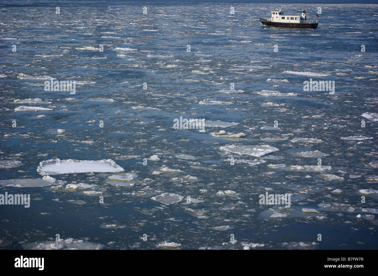 Boat Maneuvering in Icy Waters in New York City NY USA Stock Photo - Alamy