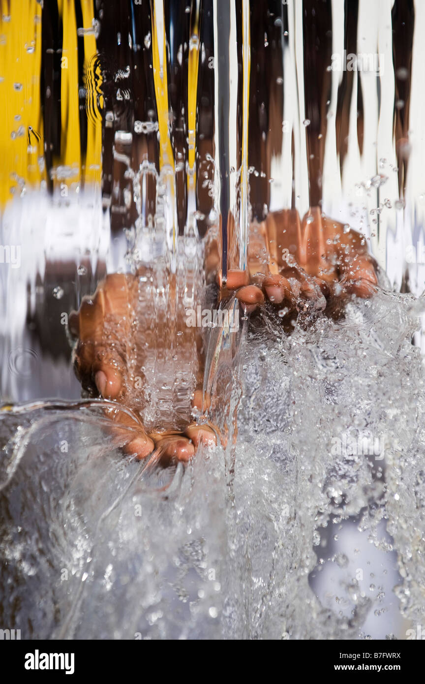 Hand through water wall hi-res stock photography and images - Alamy