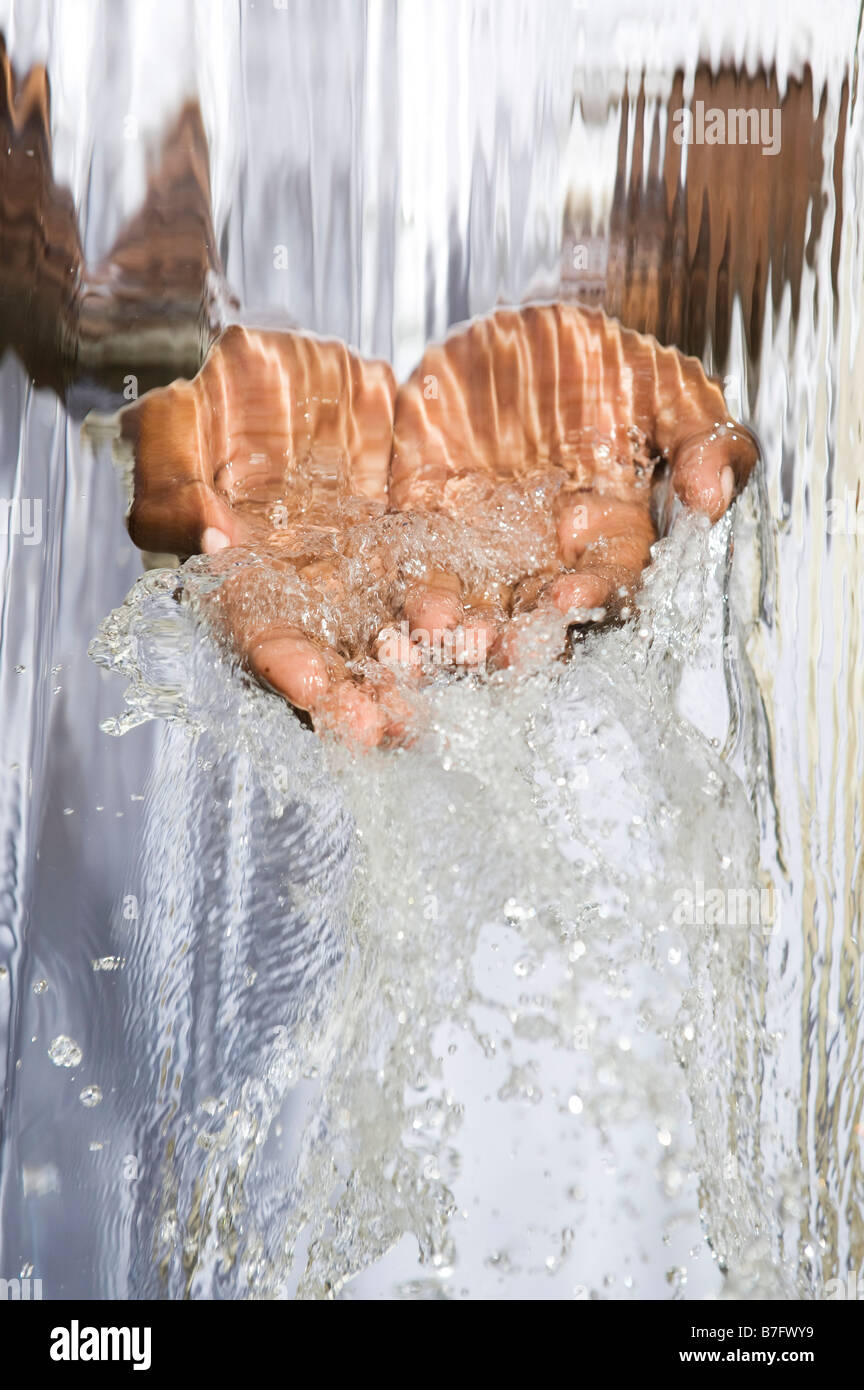 Hand through water wall hi-res stock photography and images - Alamy