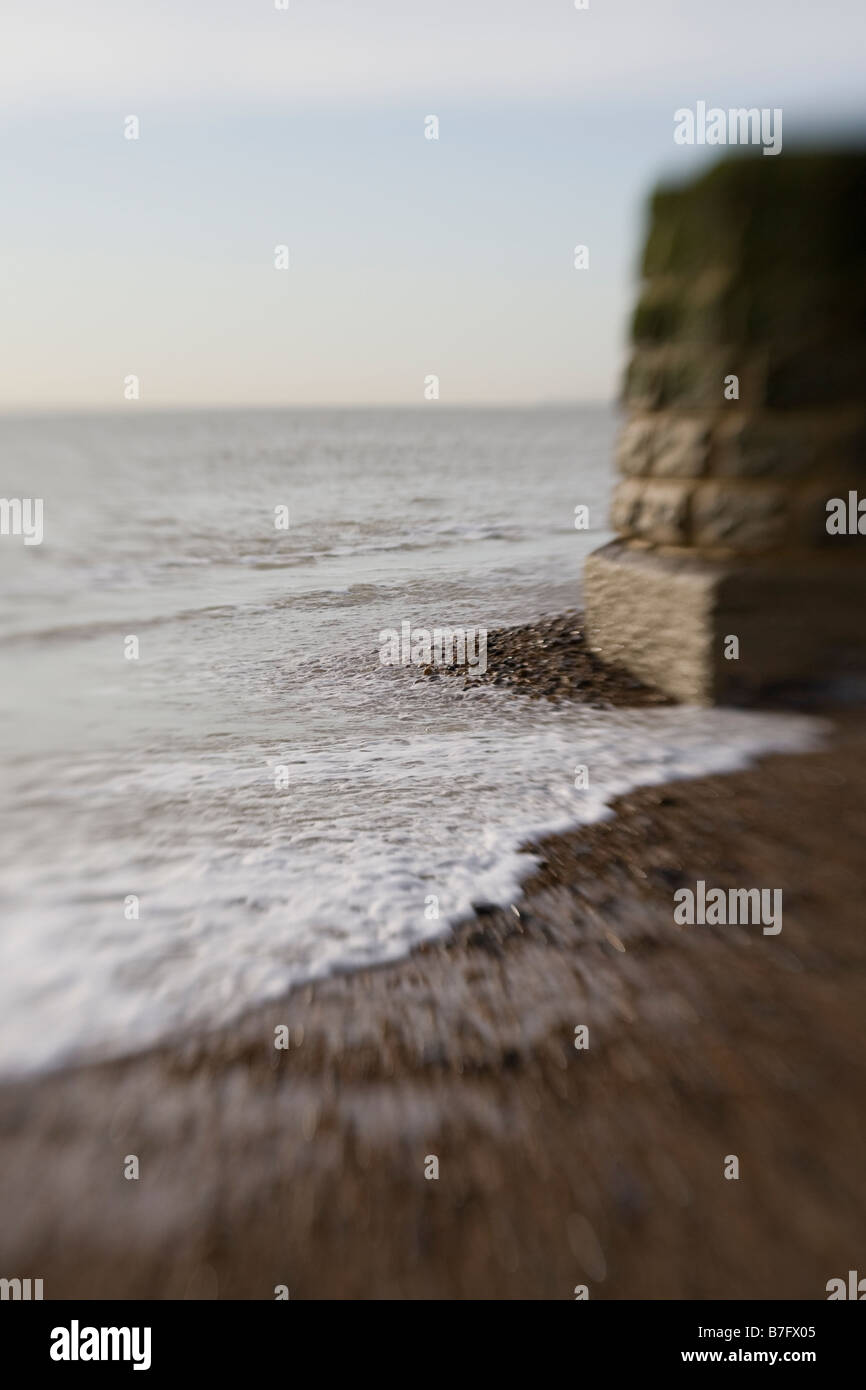 Shingle beach and concrete groyne on cold winters day, Brighton beach ...