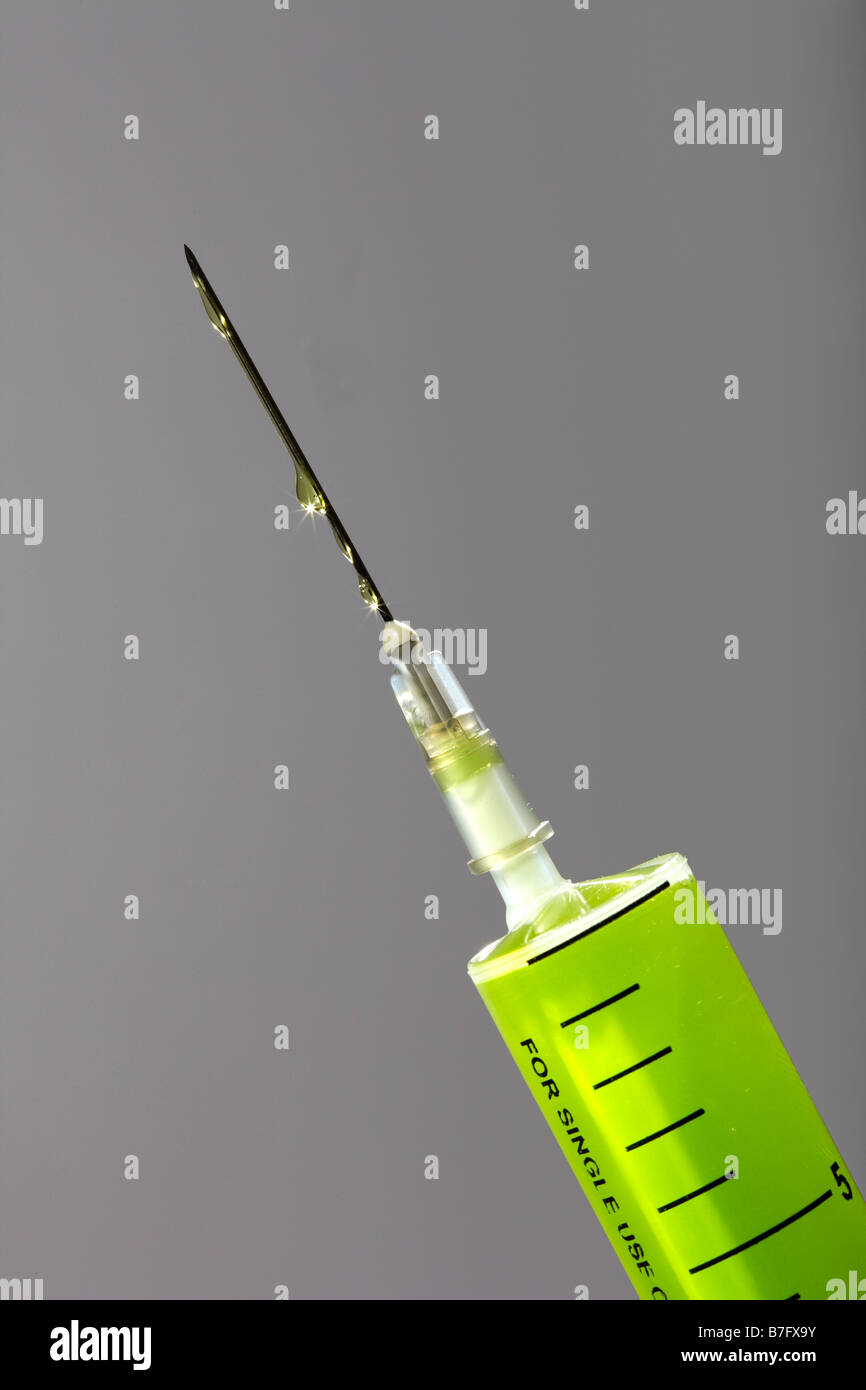 Hypodermic Syringe with Green Liquid Stock Photo - Alamy