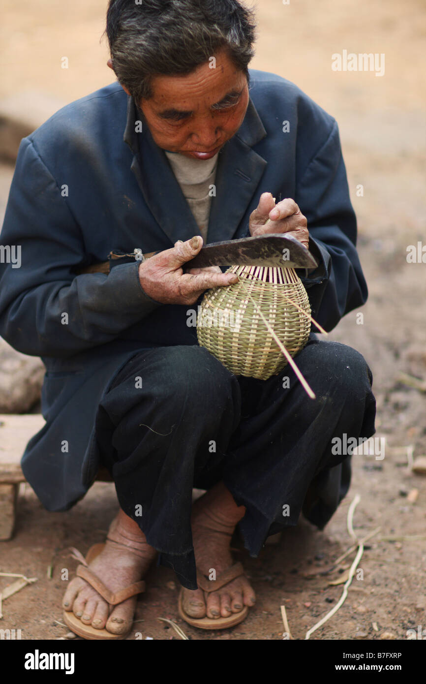 Village man basket weaving. Laos Stock Photo - Alamy