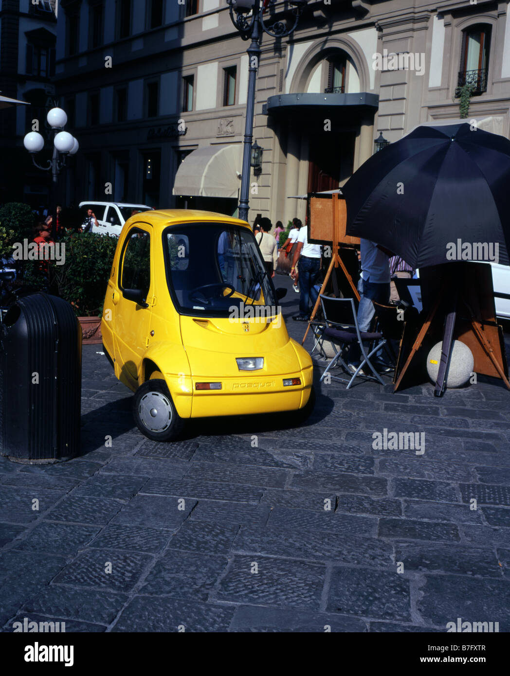 Yellow electric three wheeled car Piazza della Republica, Florence ...