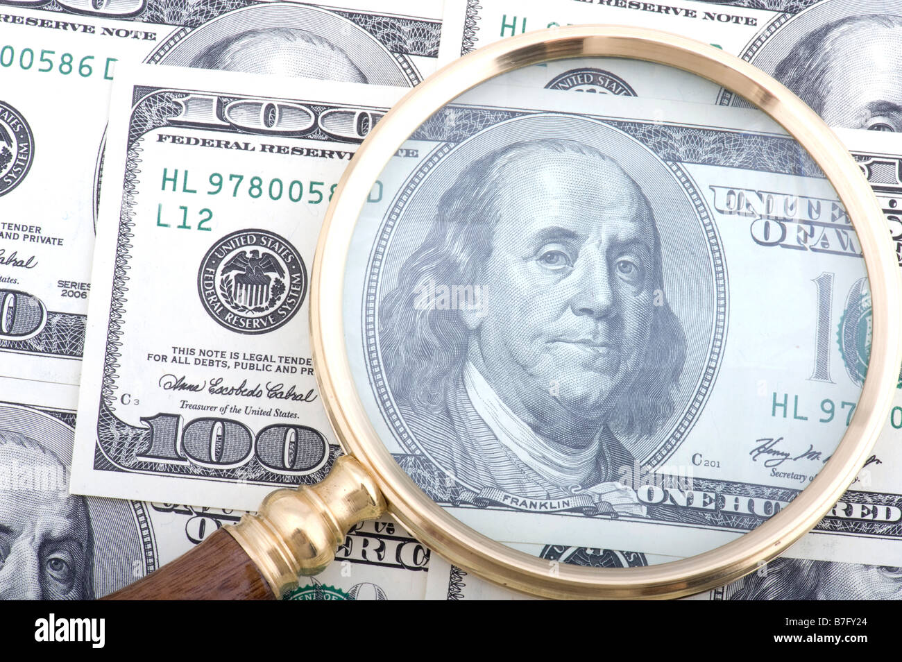 object on white currency magnifying glass with money Stock Photo - Alamy