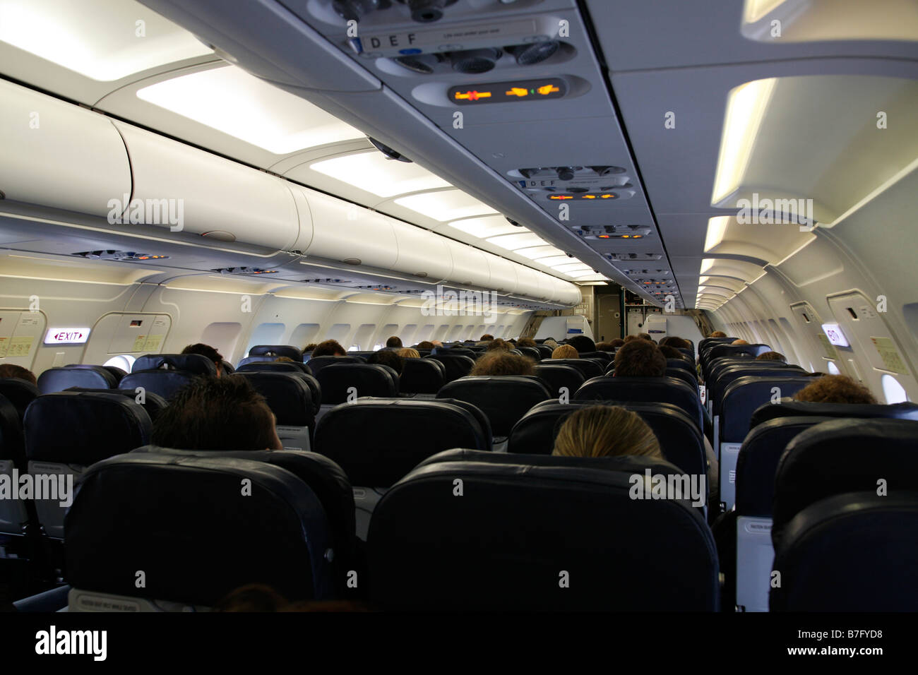 travellers in transit on a plane Stock Photo - Alamy