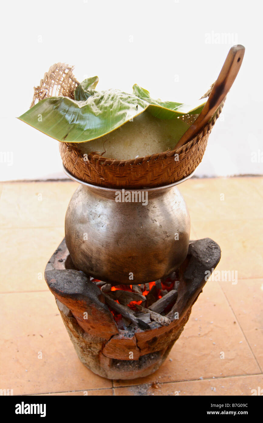 Traditional sticky rice cooking on wood fired stove Stock Photo - Alamy