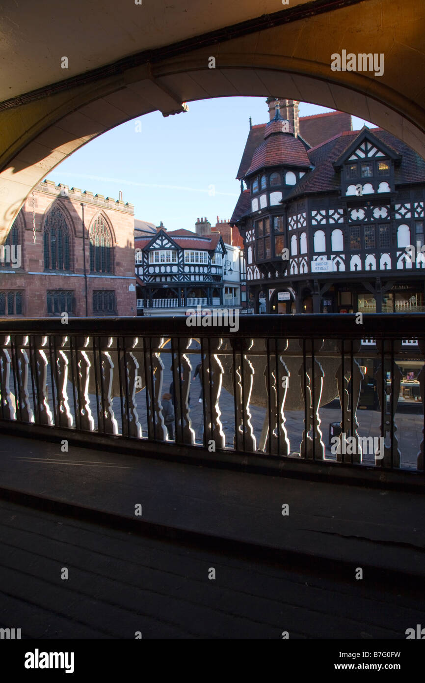 View of Chester Cross through Bridge Street Row archway Stock Photo - Alamy