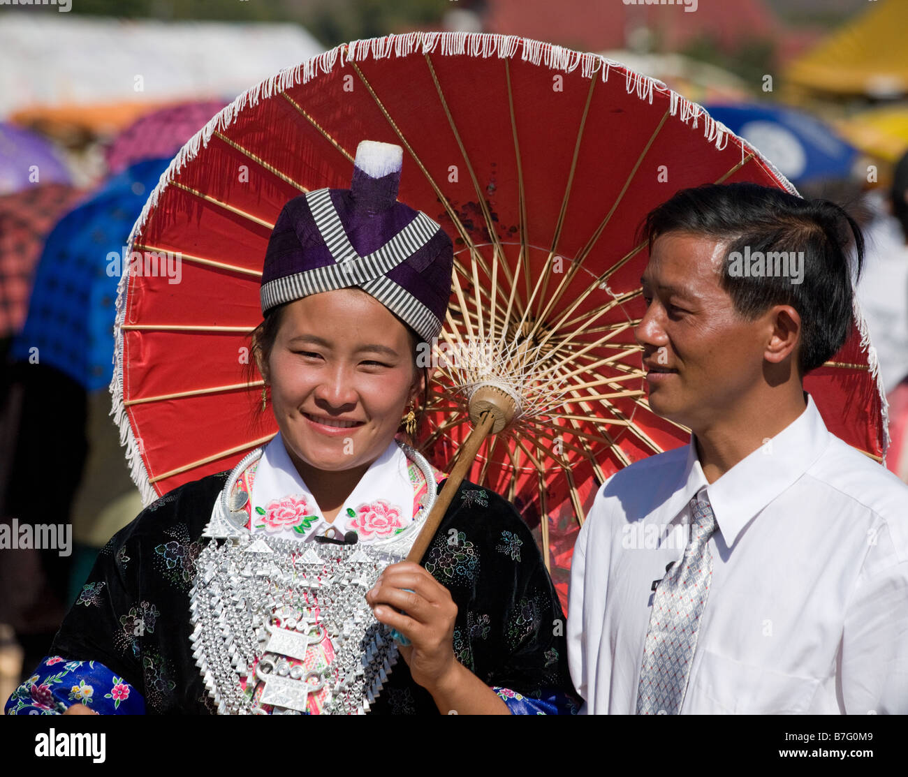 A Hmong man serenades a Hmong women at a Hmong New Year celebration ...