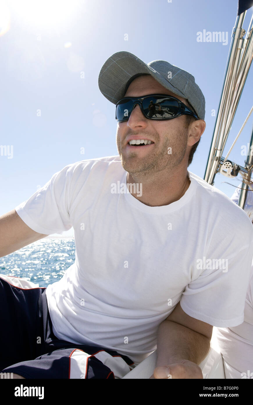 Young man sailing on a yacht Stock Photo - Alamy