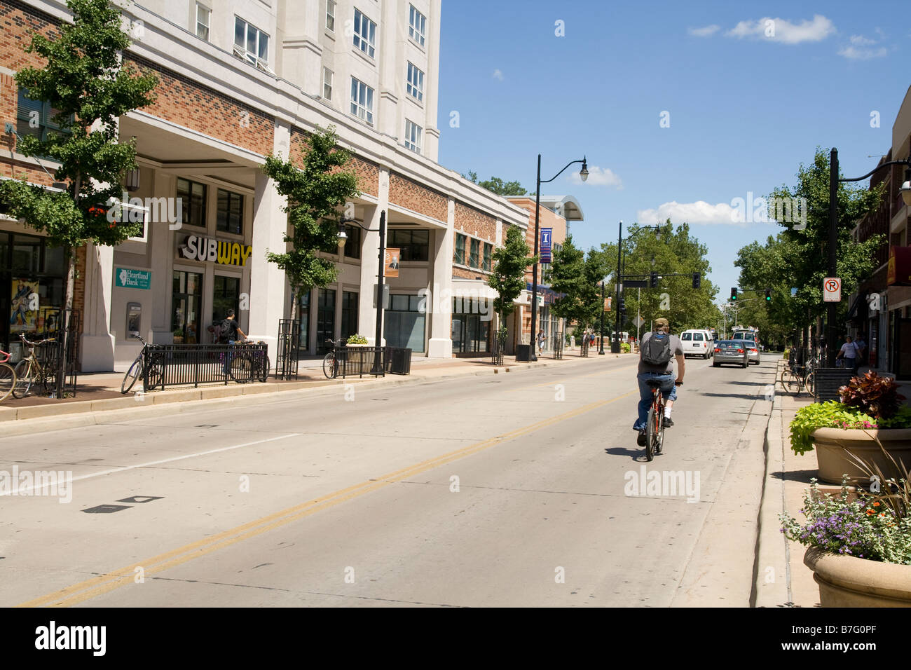 Bicycling through the college town near the campus of University of ...