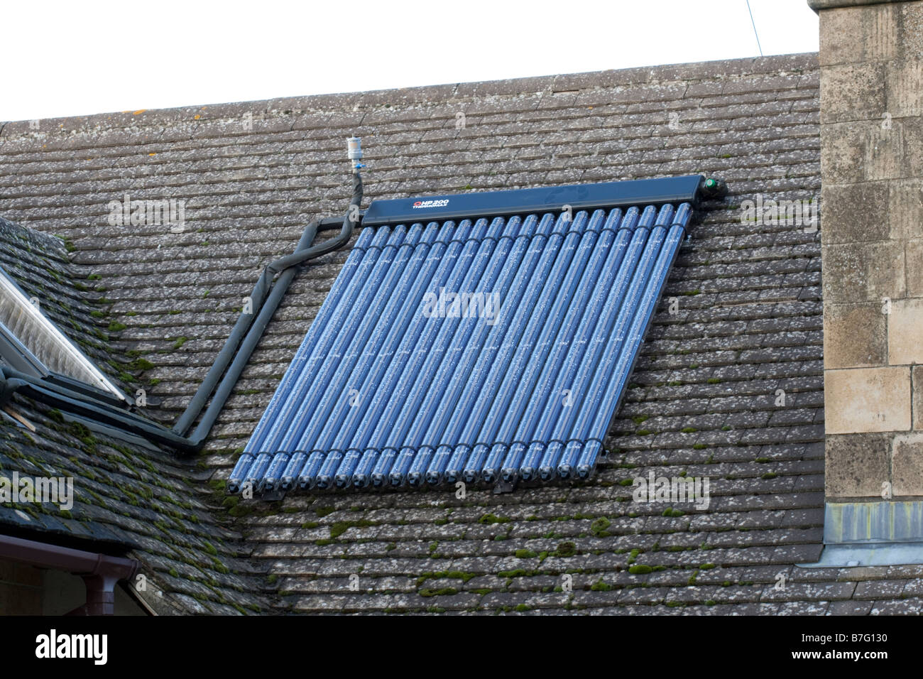 Solar thermal evacuated tubes on household roof Cotswolds UK Stock ...