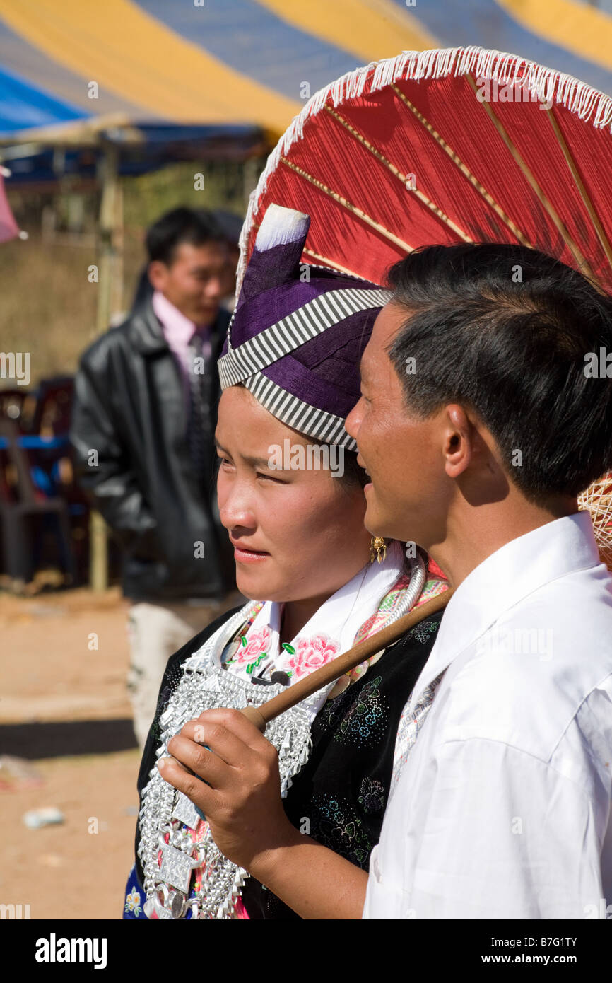 A Hmong man serenades a Hmong women at a Hmong New Year celebration ...
