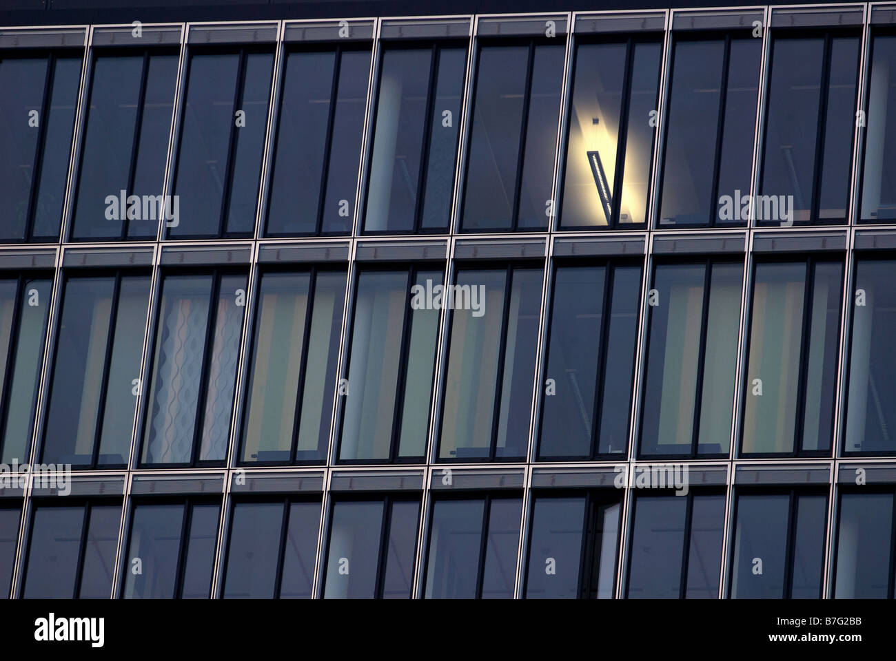 Lights on in office block hi-res stock photography and images - Alamy