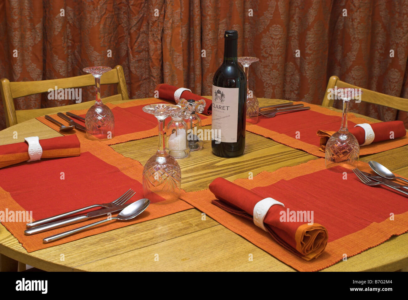 A dinner table set for four people Stock Photo - Alamy