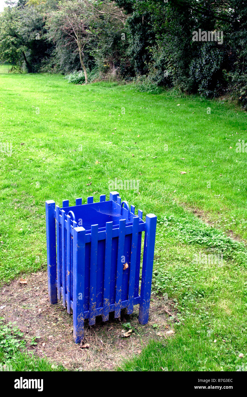 Blue litter or trash bin in park Stock Photo - Alamy