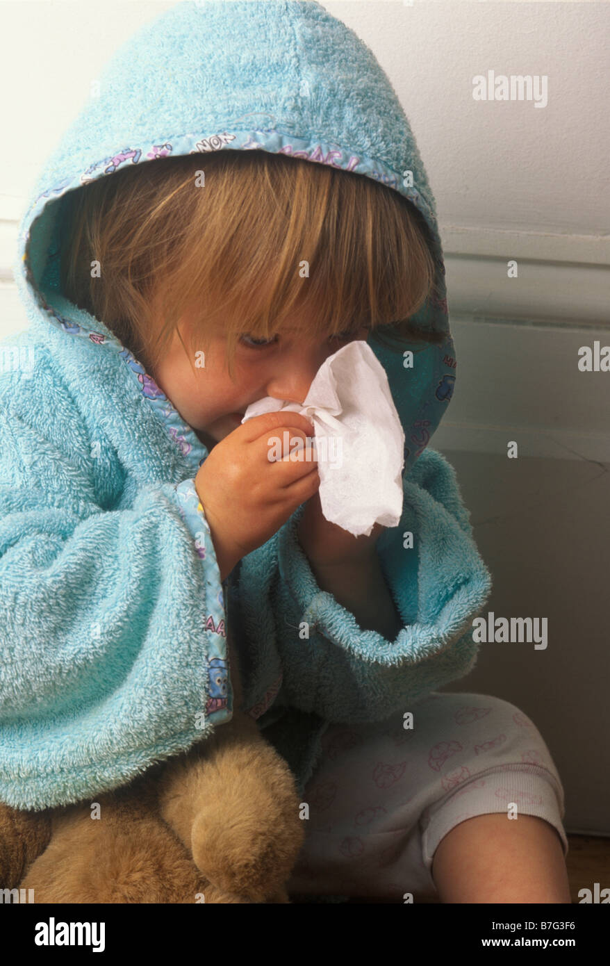 toddler blowing her nose Stock Photo - Alamy