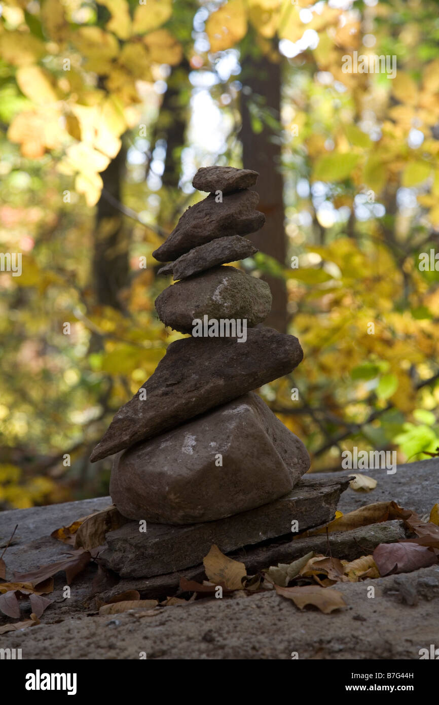 Photograph of a pile of rocks stacked in the woods Stock Photo - Alamy