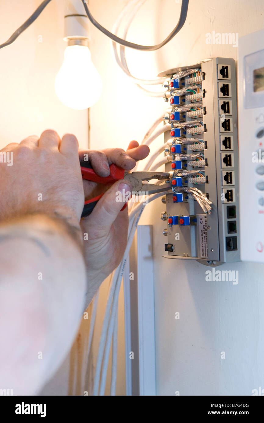 Electrician wiring a control box Stock Photo - Alamy