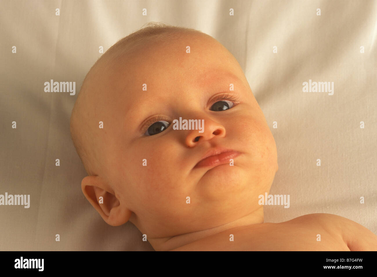 cute baby looking thoughtful Stock Photo - Alamy