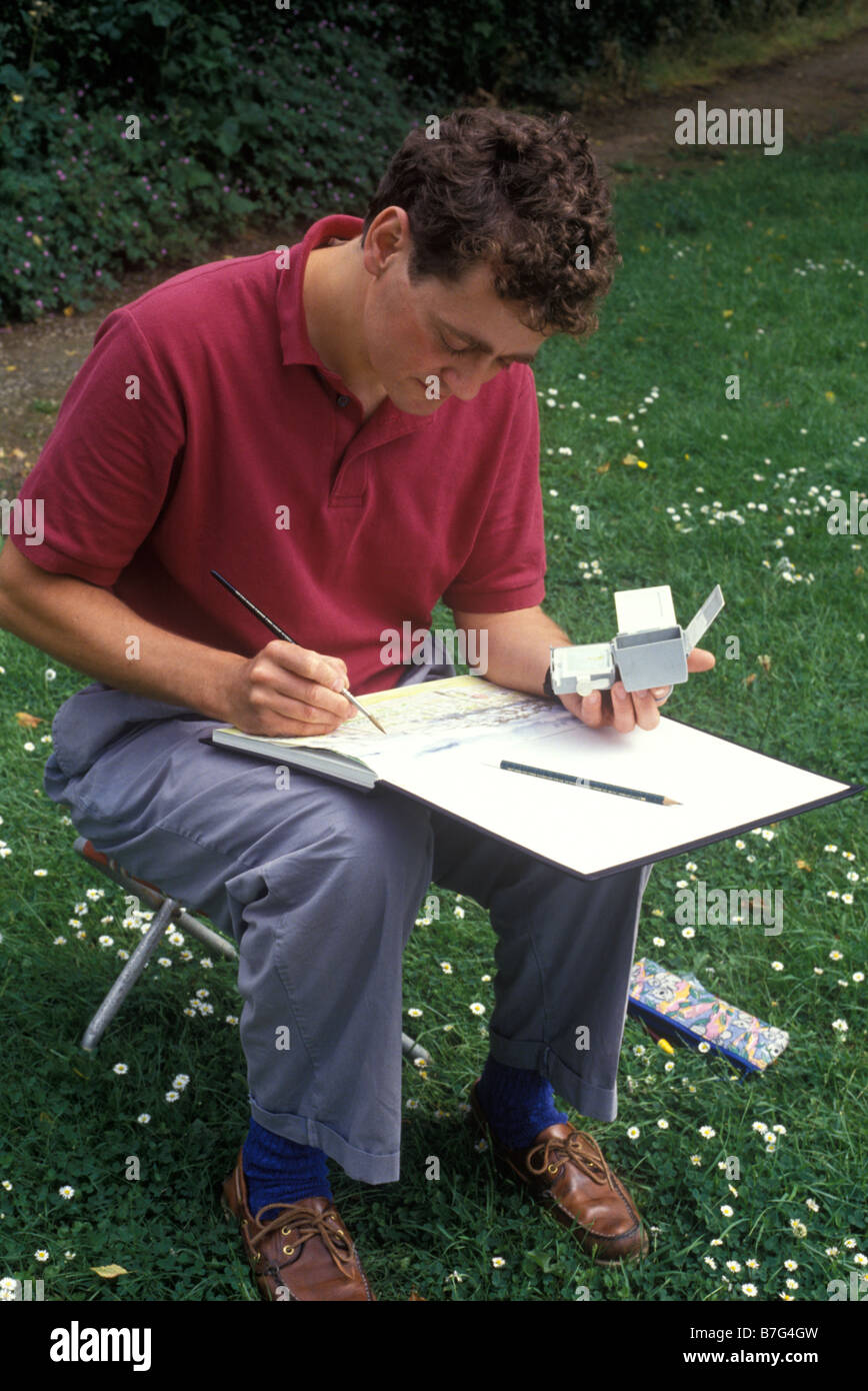 man sitting outside in the garden doing watercolour painting Stock ...