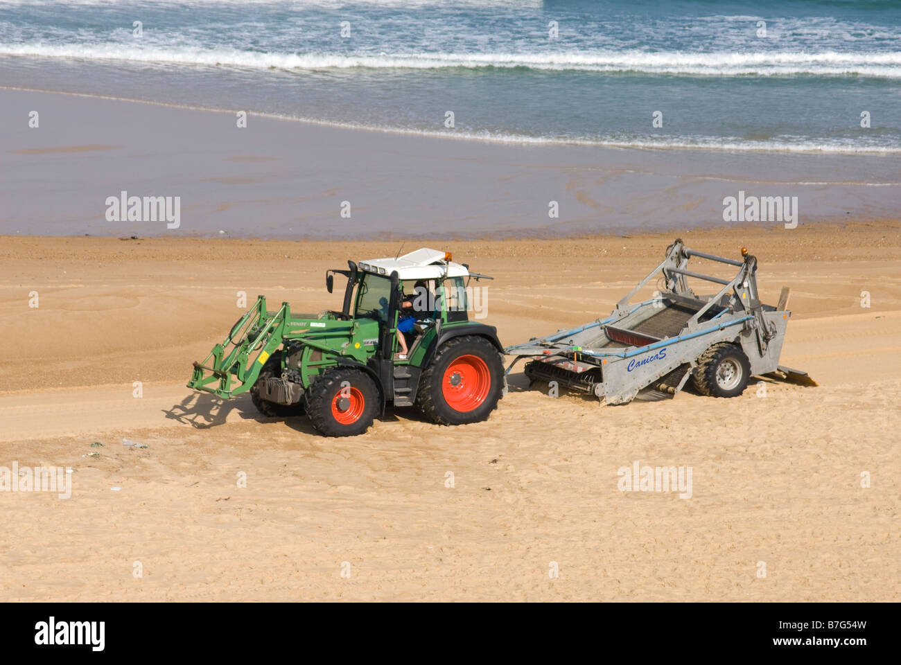 Tractor operated beach cleaning machine Stock Photo - Alamy