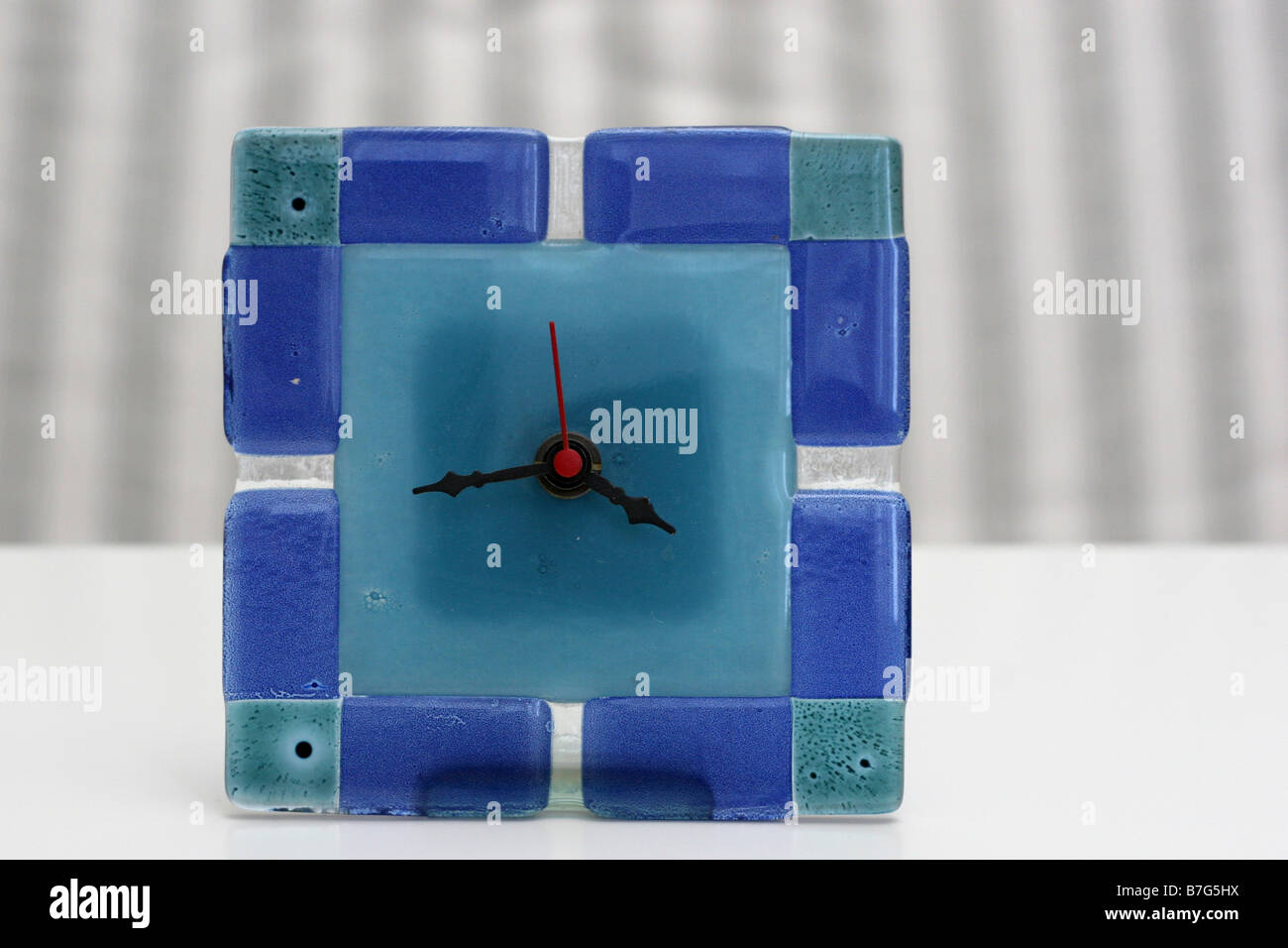 Blue analogue clock Stock Photo - Alamy