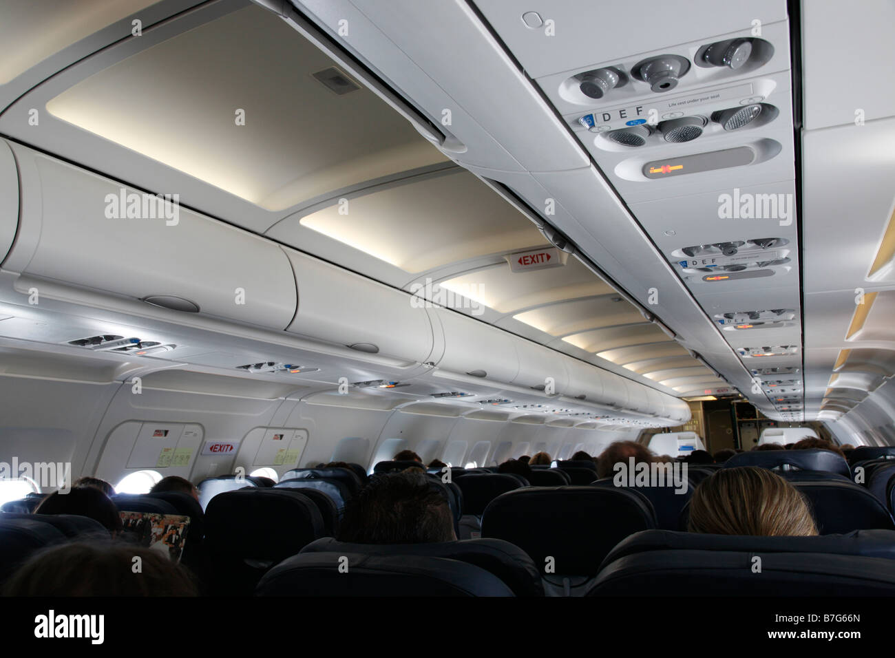travellers in transit on a plane Stock Photo - Alamy