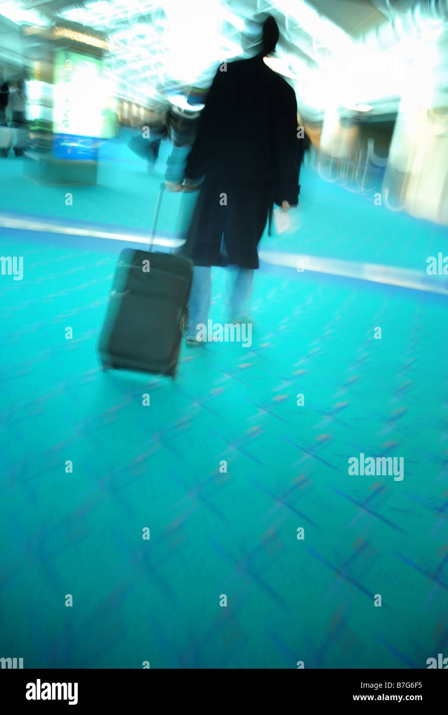 Travelers rushing through an airport terminal Stock Photo - Alamy
