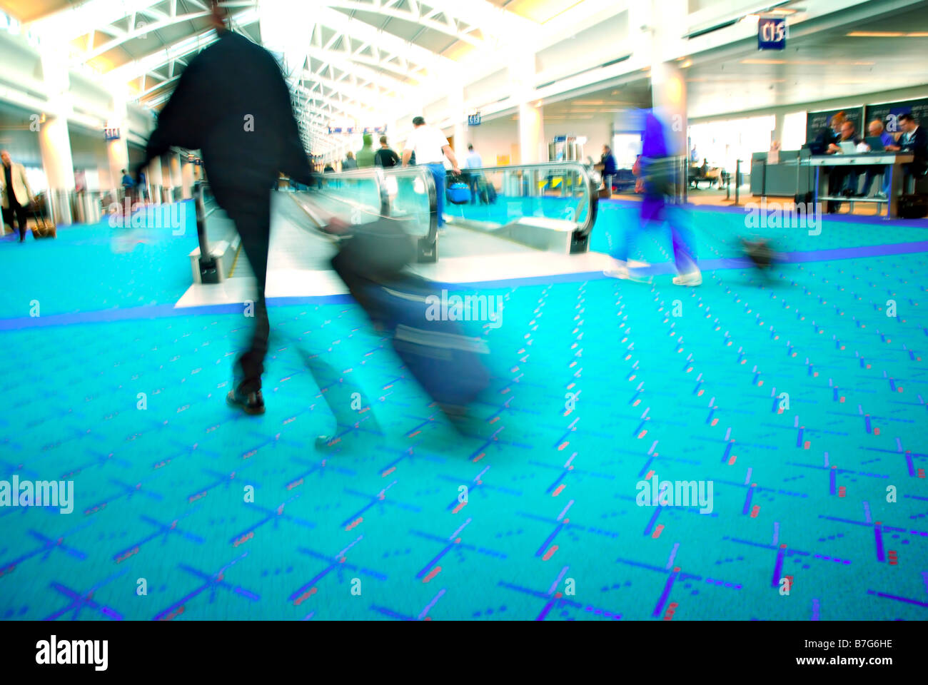 Travelers rushing through an airport terminal Stock Photo - Alamy